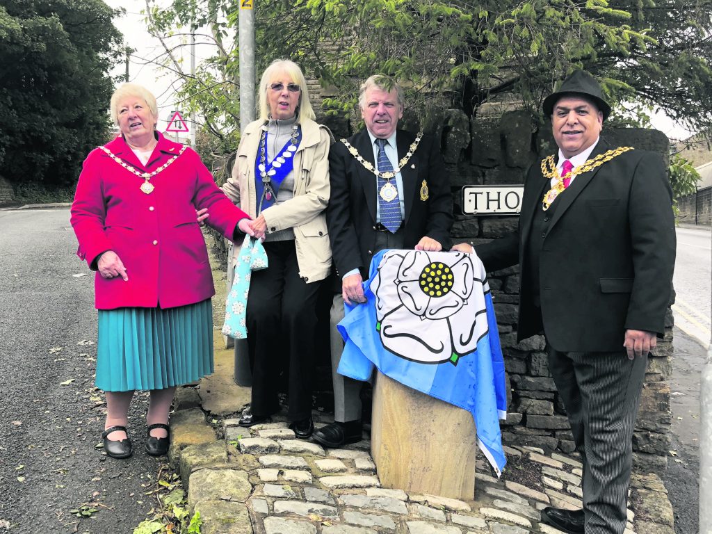 Milestone for Austerlands as new boundary sign unveiled - Saddleworth ...